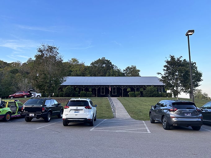 The parking lot view reveals the restaurant's modest exterior, proving great food doesn't need fancy architecture—just hungry people who appreciate authenticity.
