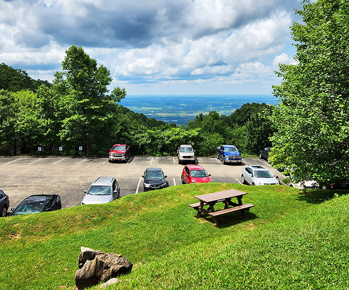 The parking area offers mountain views that serve as appetizers for the underground main course.