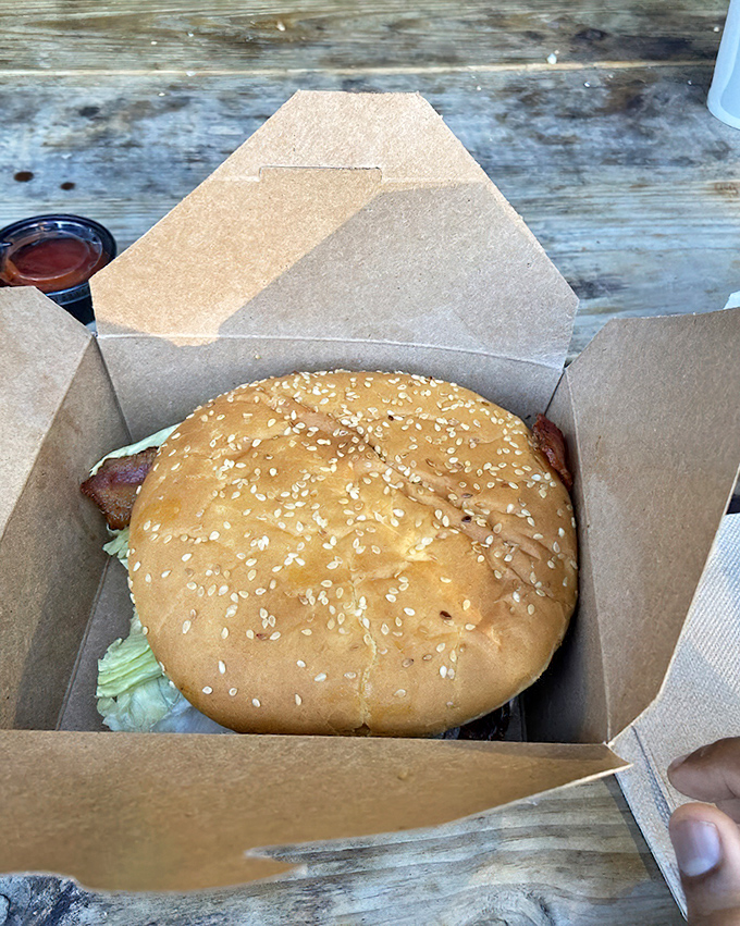 A pastrami burger that bridges the gap between sandwich and burger worlds. That pink meat peeking out is sending a delicious invitation.