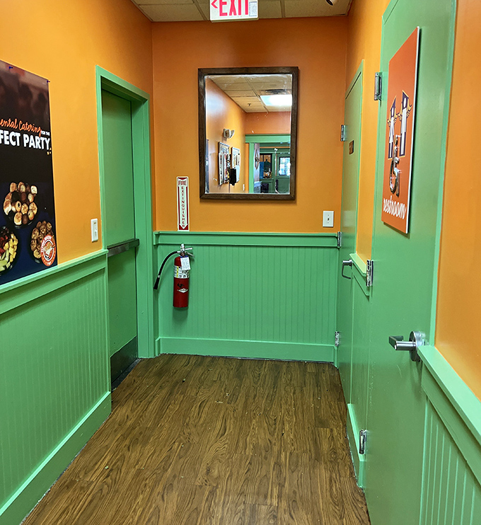 Even the hallway continues the cheerful color scheme&mdash;because at Flying Biscuit, even the path to the restroom should spark joy.