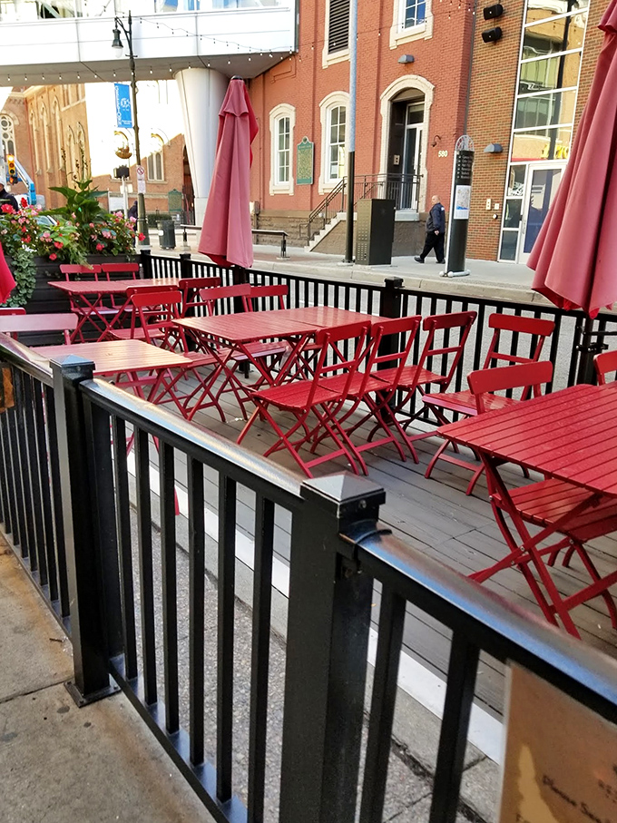 The patio – where fresh air meets fresh barbecue. Those red tables have hosted countless summer evenings of meaty indulgence.