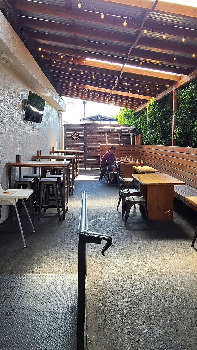 The patio at Moo's offers al fresco dining under string lights&mdash;because barbecue tastes even better with a side of fresh air.
