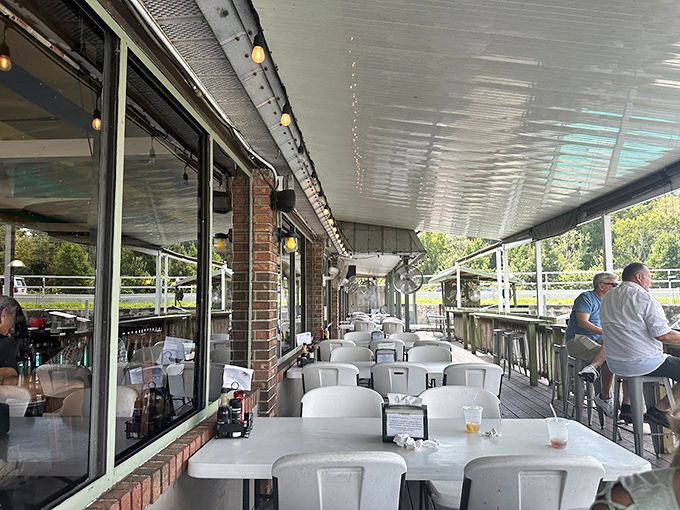Outdoor dining that captures the essence of Florida living. Simple tables, fresh air, and the promise of pelicans potentially photobombing your meal.