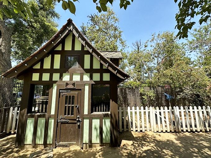 This Tudor-style cottage looks like it jumped straight from a Beatrix Potter illustration. Peter Rabbit would approve of the white picket fence!
