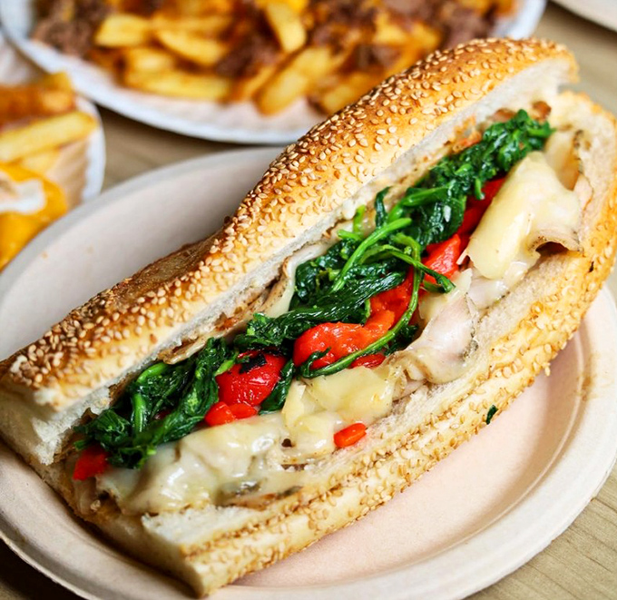 A sandwich that brings together roasted meat, greens, and peppers in such perfect harmony, they should form a band and go on tour.