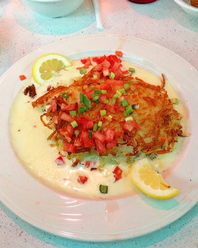 Potato-crusted grouper topped with fresh salsa, proving this diner knows its way around Florida's favorite fish.