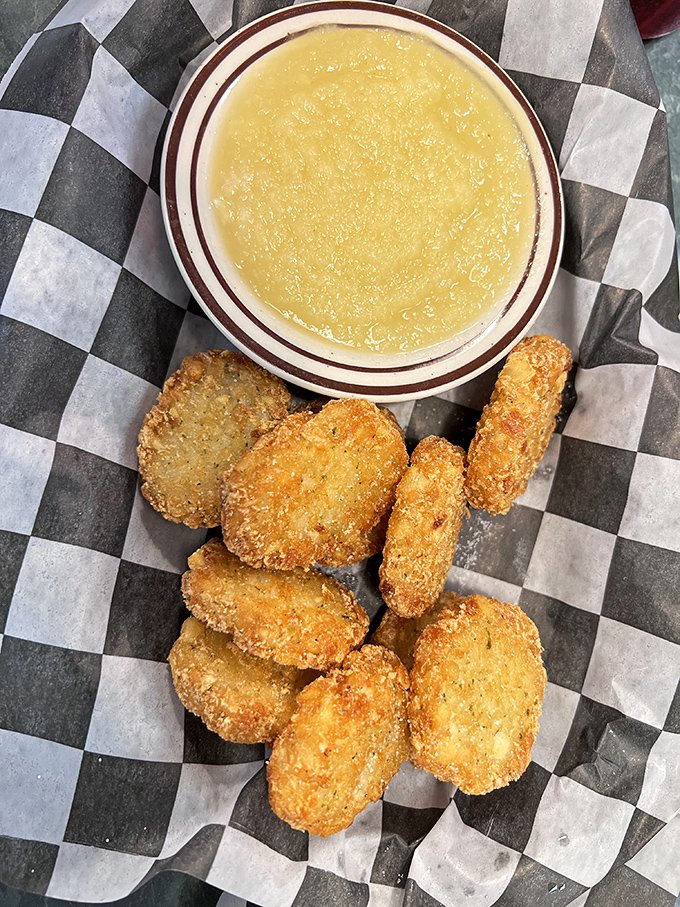 Golden-fried potato pancakes with applesauce&mdash;proof that sometimes the simplest combinations are culinary genius in disguise.