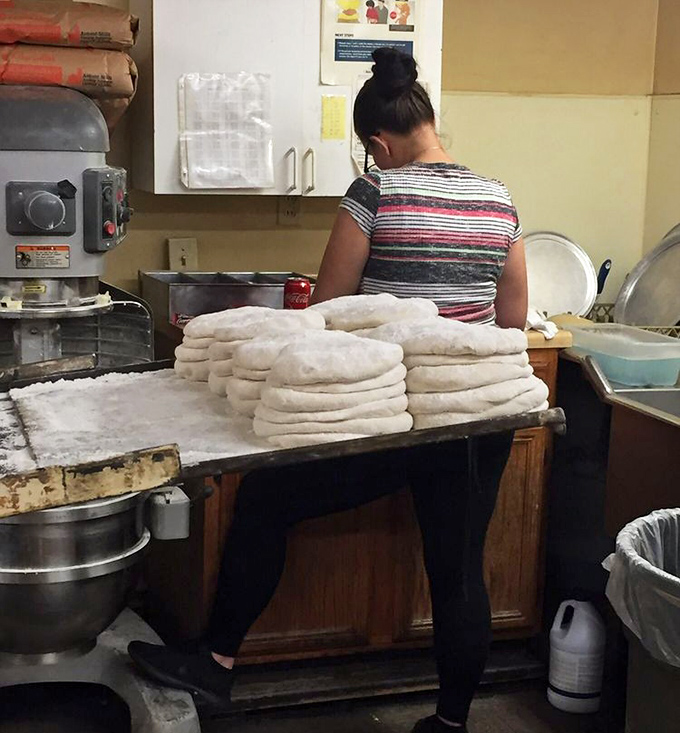 Those hands are crafting more than dough—they're shaping the foundation of a culinary tradition that's outlasted eight presidential administrations.