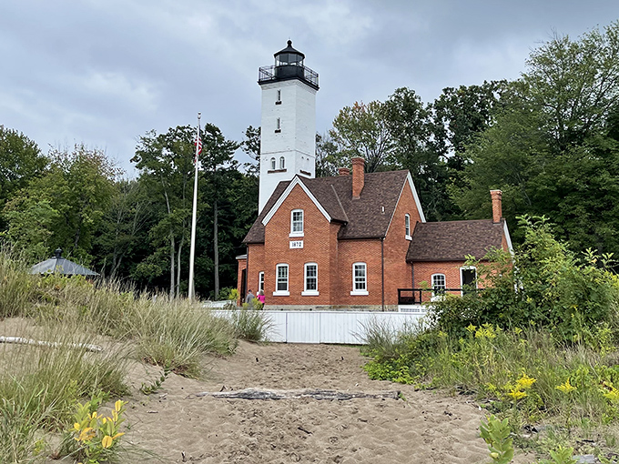 Presque Isle Lighthouse stands as Erie's postcard-perfect icon, where brick, sand, and sky create a timeless tableau of Great Lakes maritime heritage.
