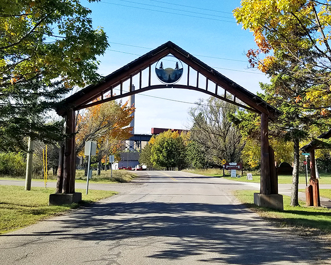 Presque Isle Park's wooden archway stands as a portal to adventure, inviting visitors to discover the peninsula's natural wonders just beyond the city limits.