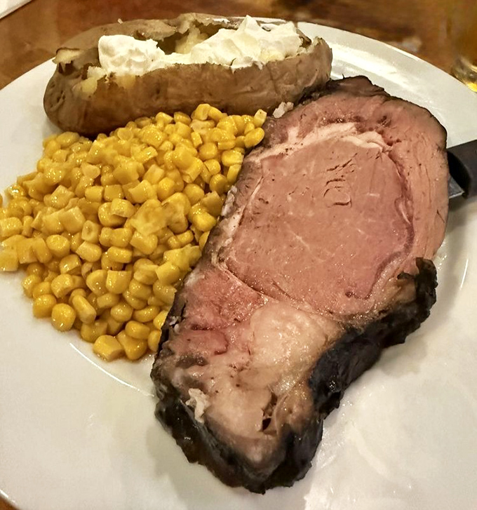 Prime rib so tender it practically cuts itself. The baked potato stands by, ready to soak up all those magnificent juices.