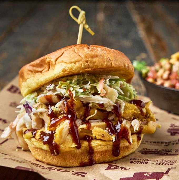 The pulled chicken sandwich topped with slaw brings the perfect balance of smoke, sauce, and crunch&mdash;proof that barbecue isn't just about beef and pork.
