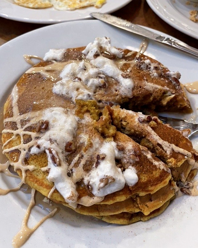 Pumpkin pancakes drizzled with icing and topped with pecans&mdash;autumn's greatest gift to breakfast, available whenever your heart desires it. 