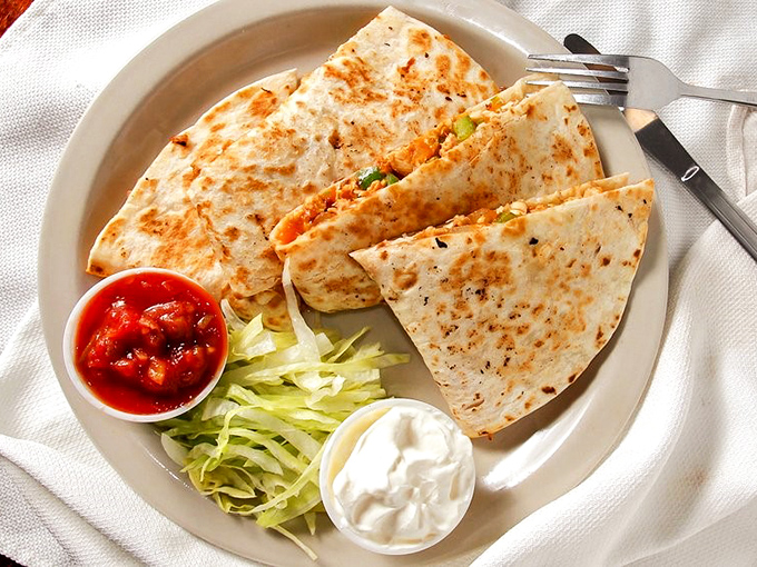 A quesadilla that bridges the gap between breakfast and lunch with melted cheese diplomacy.