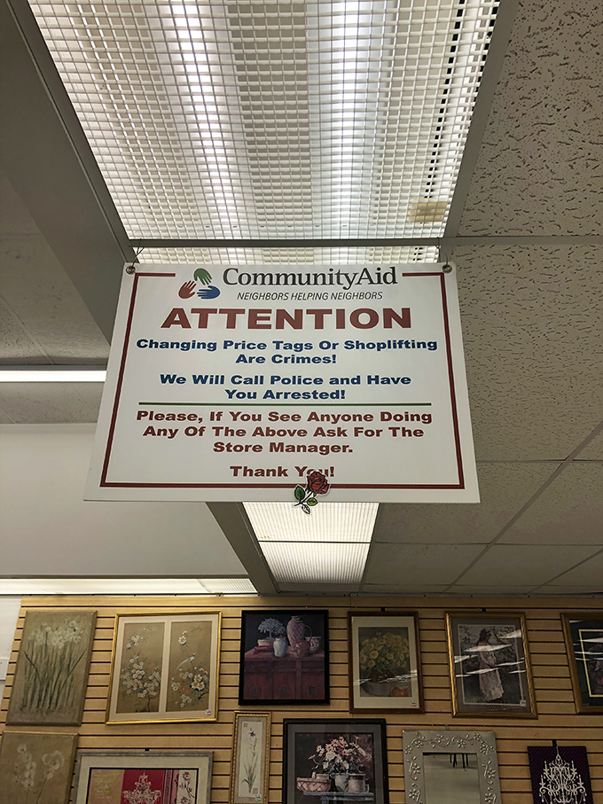 The stern warning sign&mdash;a reminder that even in bargain paradise, rules apply. The thrift store equivalent of "don't feed the animals."