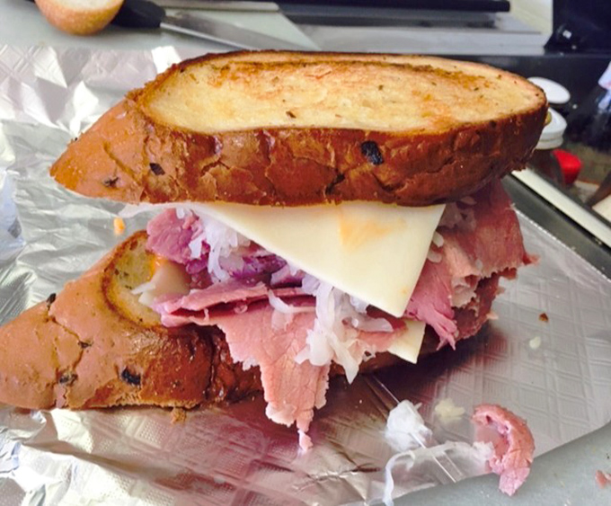 The Reuben sandwich: where corned beef meets sauerkraut in a love story that never gets old.