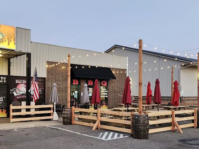 Road Hog Willy's outdoor seating invites you to savor smoky BBQ delights under string lights&mdash;because good food tastes even better with a side of fresh air.