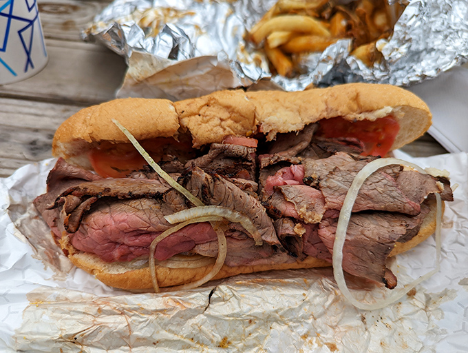 The roast beef sub in its natural habitat: wrapped in paper, ready for devouring. Those thin-sliced layers of beef with raw onion are a Baltimore tradition worth embracing.