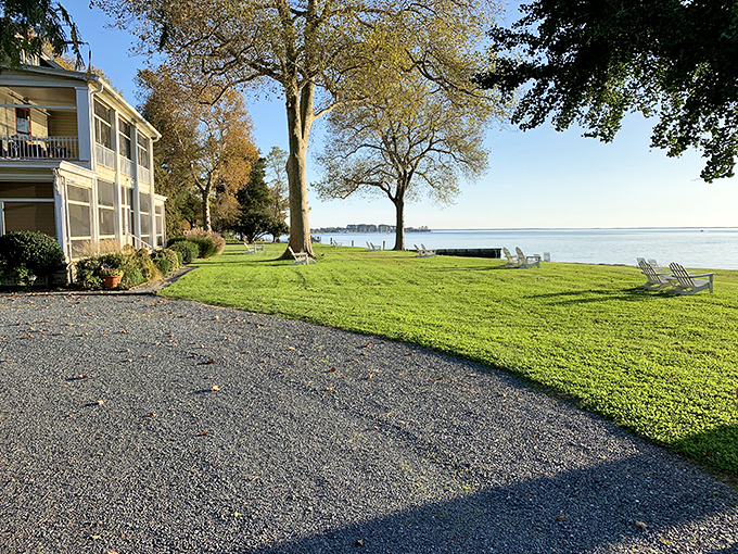 Adirondack chairs face the water, patiently waiting for someone to sink in and let the Chesapeake views wash away urban anxieties.