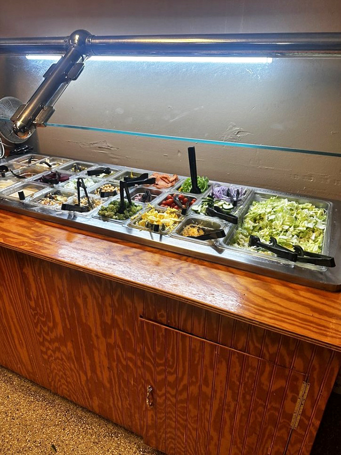 A salad bar that understands its purpose: fresh ingredients that complement rather than compete with the seafood main event.