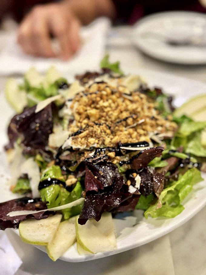 This salad isn't just a prelude to pizza&mdash;it's worthy of its own standing ovation. Crisp greens, crunchy nuts, and shaved cheese in perfect harmony.