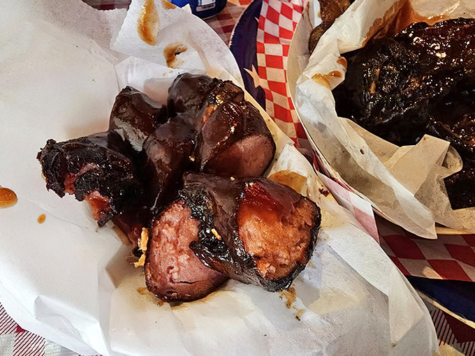 Sausages glistening like edible jewelry &ndash; each link a promise of smoky, savory satisfaction.