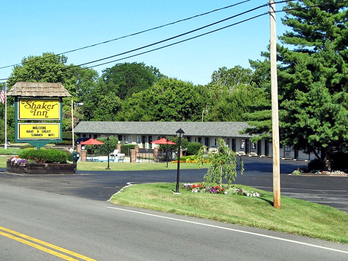 The Shaker Inn sign promises a respite from the road, a reminder that not all treasures require a passport and currency exchange.
