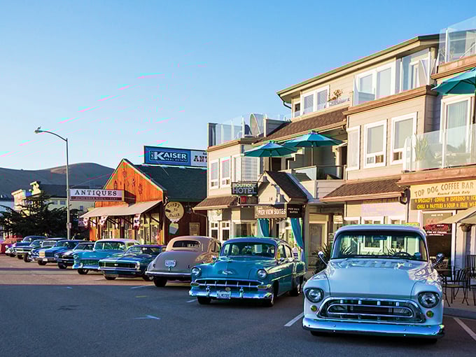 Classic cars line Ocean Avenue like a time-traveling car show where every chrome bumper reflects simpler, shinier times.