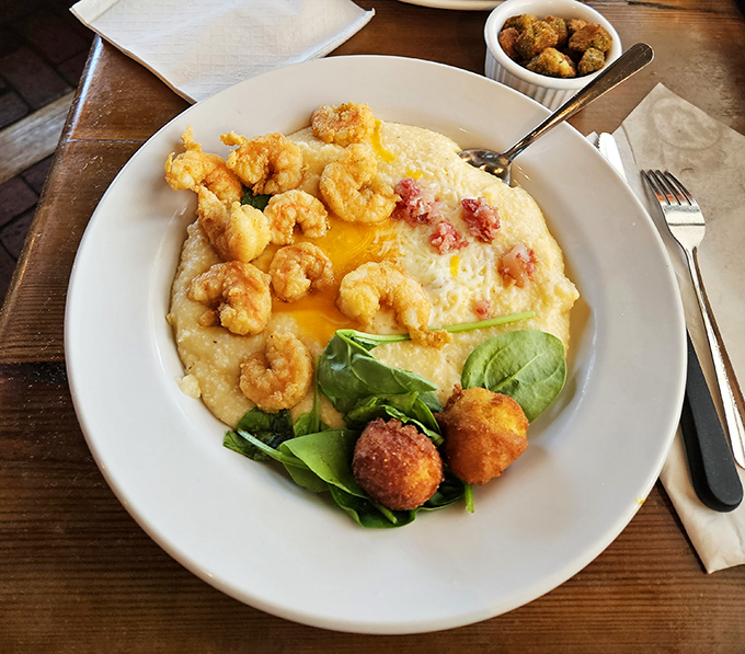 Shrimp and grits elevated to an art form&mdash;creamy cornmeal canvas painted with perfectly cooked crustaceans and a splash of green.