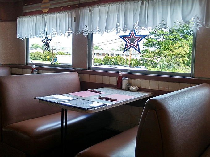 Cozy booth seating perfect for lingering over coffee while planning your next visit to this gem.