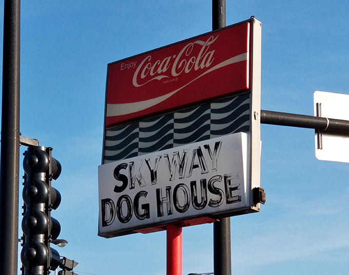The street sign announces your arrival at hot dog paradise. Like the North Star for hungry travelers, it guides you home.