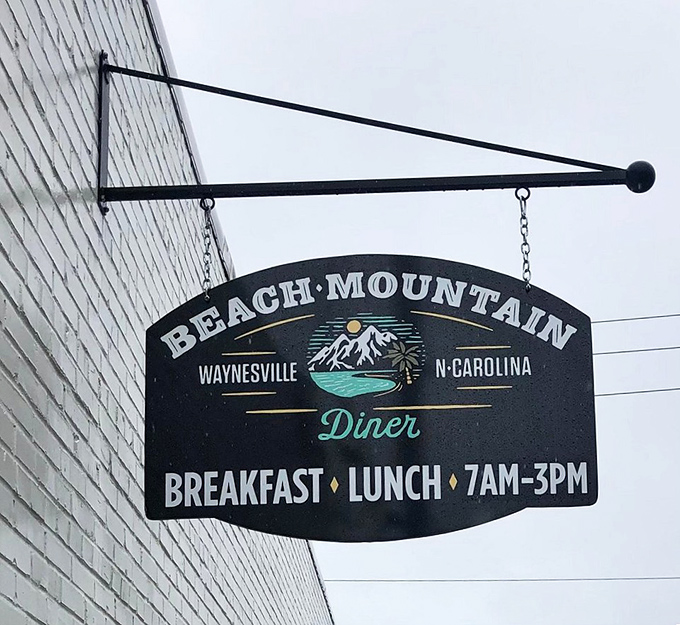 The hanging sign tells you everything you need to know: breakfast, lunch, and the perfect hours for both. No dinner needed when breakfast is this good.