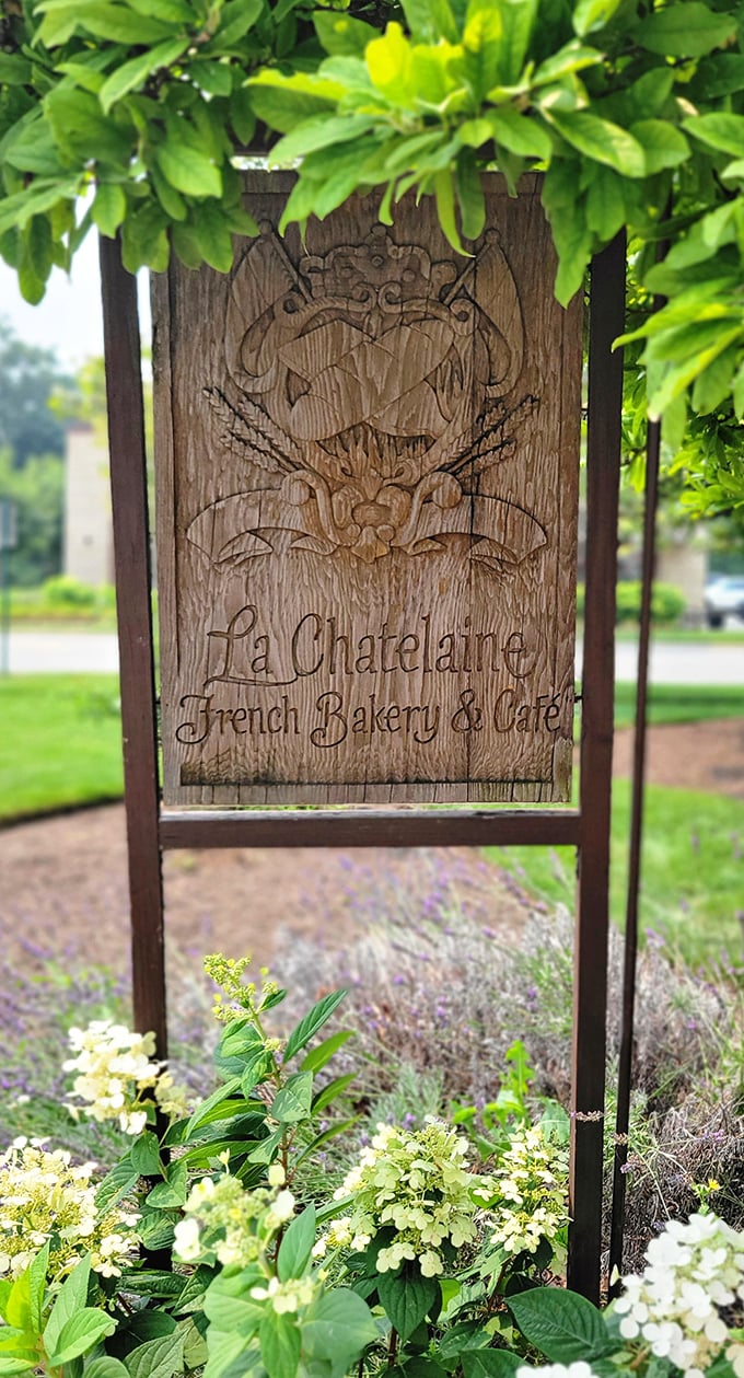 A wooden sign nestled among flowers&mdash;like finding a secret garden entrance to a world where calories don't count and time slows down.