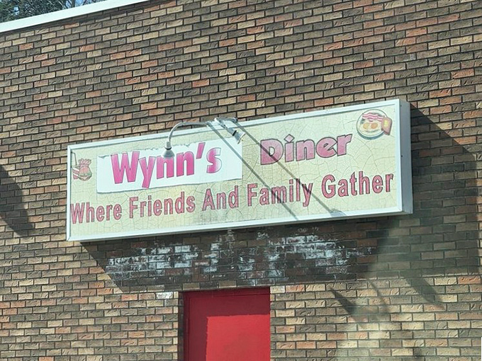 "Where Friends And Family Gather"&mdash;not just a slogan, but a mission statement written in pink neon promise.