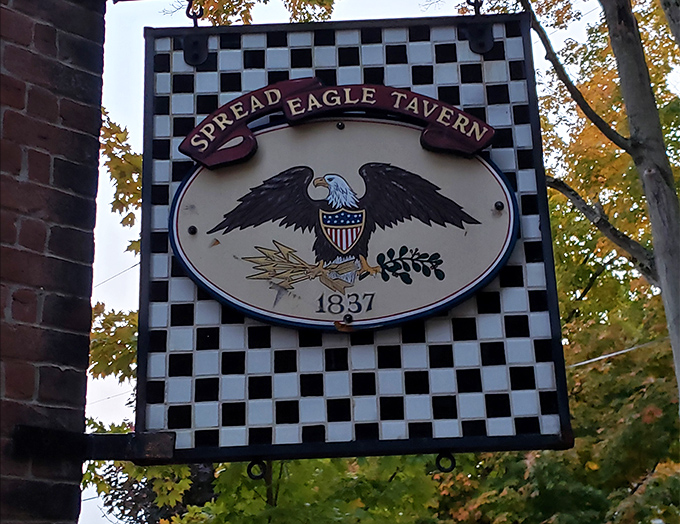 The tavern's iconic sign announces its 1837 heritage with patriotic flair. That eagle isn't just spreading its wings &ndash; it's inviting you inside.