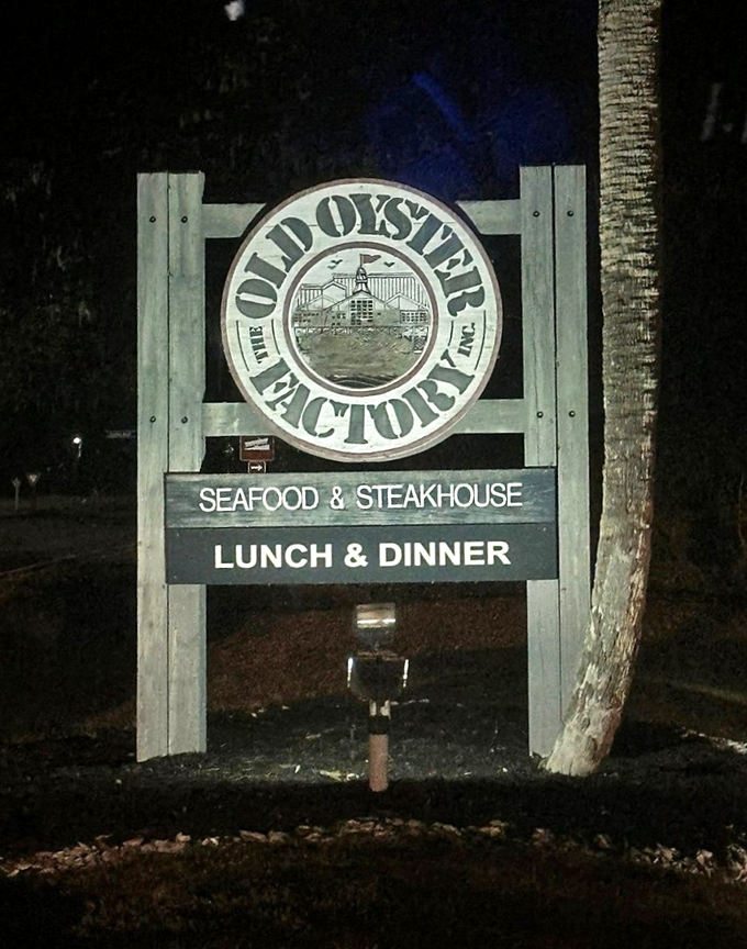 Even in darkness, this sign shines like a beacon for seafood lovers, guiding hungry travelers to their delicious destination.