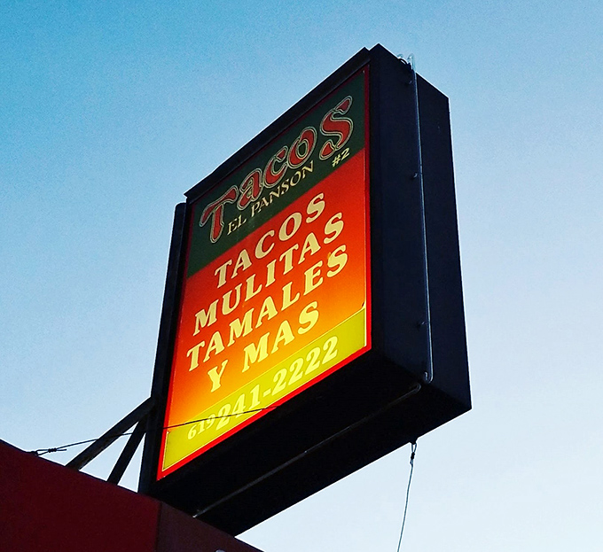 That glowing sign beckoning hungry souls like a lighthouse guides ships to safety and satisfaction.