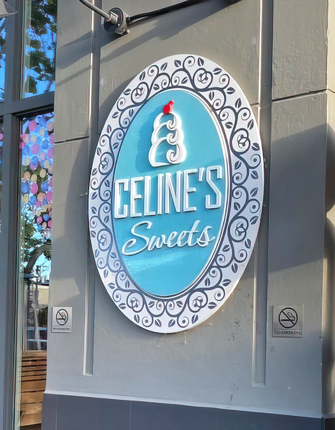 That turquoise and white logo glows like a beacon of sweetness against the gray exterior—a sugar lighthouse guiding you to shore.