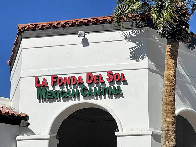 The sign says "Mexican Cantina" but might as well read "Happiness Headquarters." That palm tree isn't just decoration&mdash;it's setting expectations.