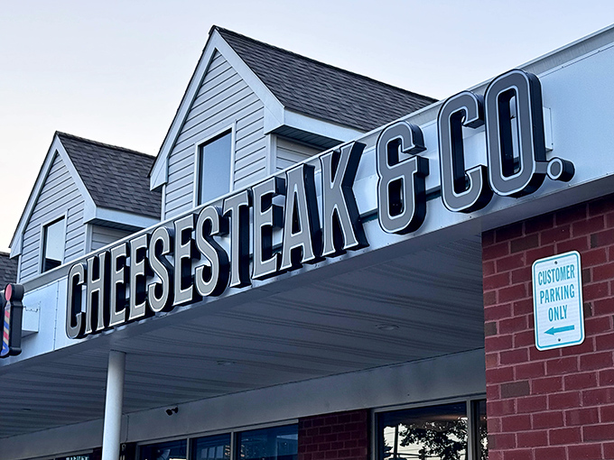 The name looms large above the entrance, a beacon for cheesesteak pilgrims seeking authentic flavors in unexpected places.