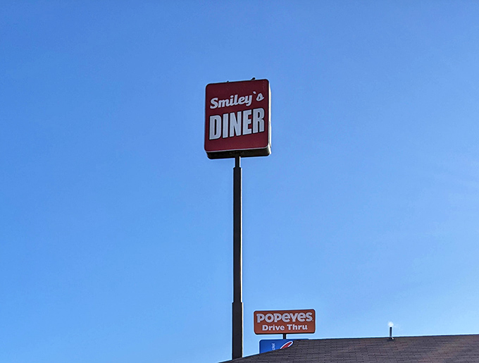 The Smiley's sign against a clear blue sky – like a North Star for hungry travelers seeking breakfast salvation.