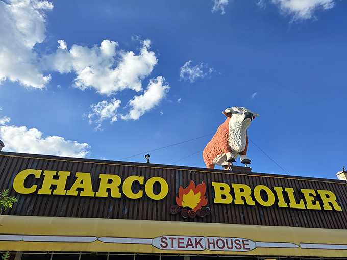 That majestic cow silhouette atop the sign isn't just decoration—it's a bovine beacon guiding hungry travelers to protein paradise.