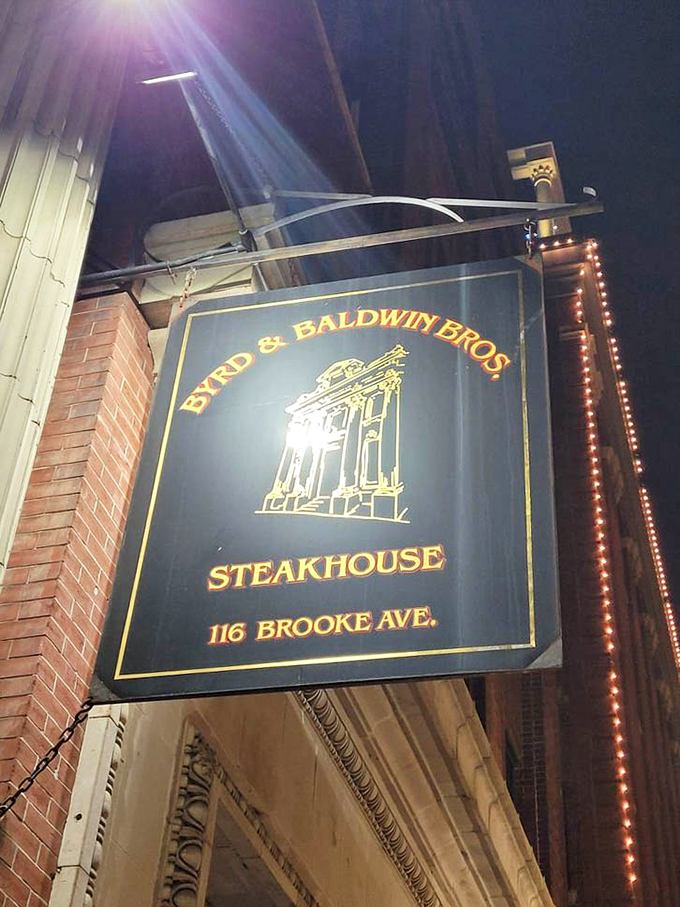 The hanging sign serves as a beacon for those seeking serious steak satisfaction. Like a North Star for hungry travelers, it guides you to your delicious destination.