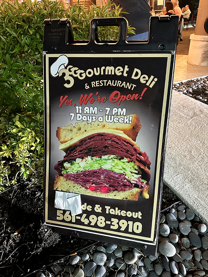 The sidewalk sign says it all&mdash;that sandwich isn't just stacked, it's architectural. A skyscraper of flavor that demands to be demolished.