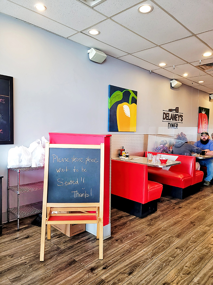 "Please wait to be seated" is diner-speak for "Good things come to those who wait." The vibrant red booths promise it'll be worth it.