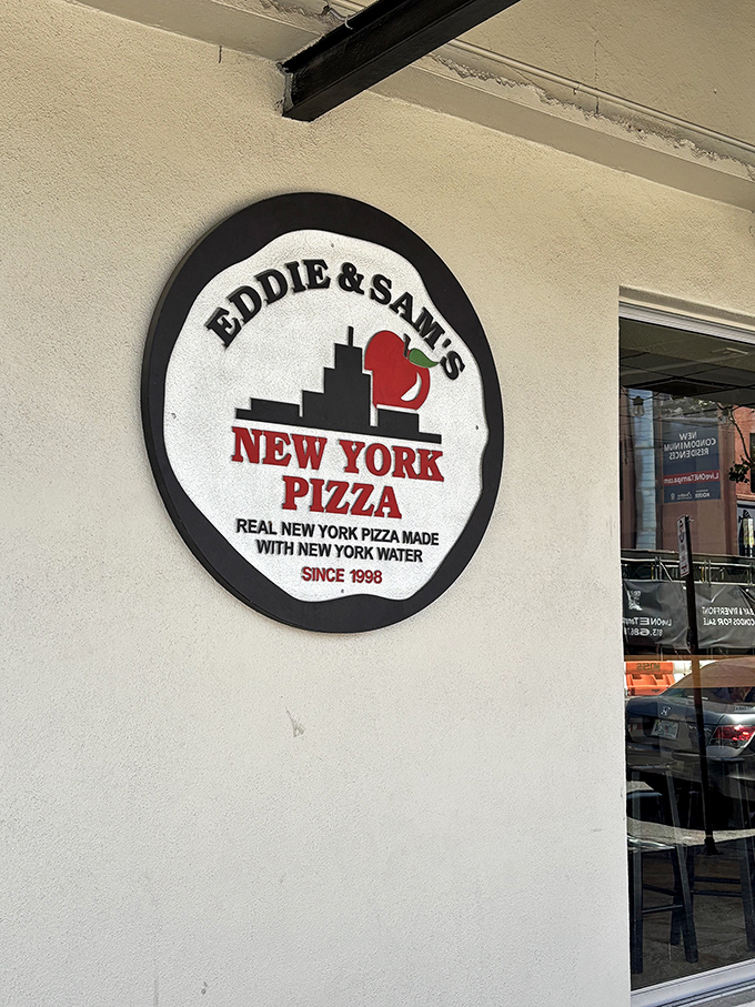 The logo says it all&mdash;"Real New York Pizza Made With New York Water." Some restaurants talk the talk; Eddie and Sam's ships in the proof.