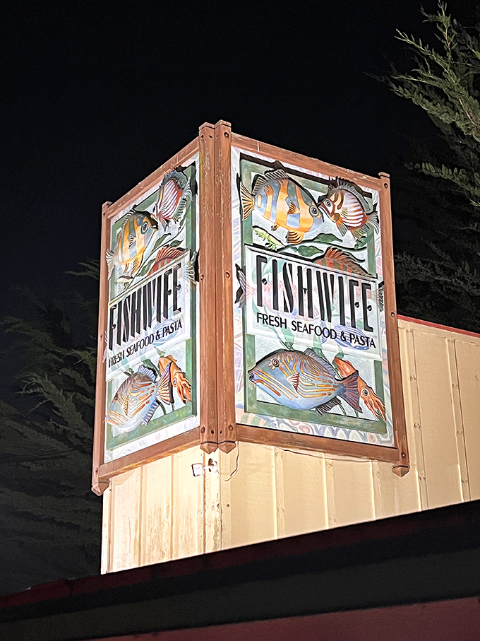 Fishwife's charming hand-painted sign announces "Fresh Seafood & Pasta" with colorful fish artwork that promises oceanic delights within.