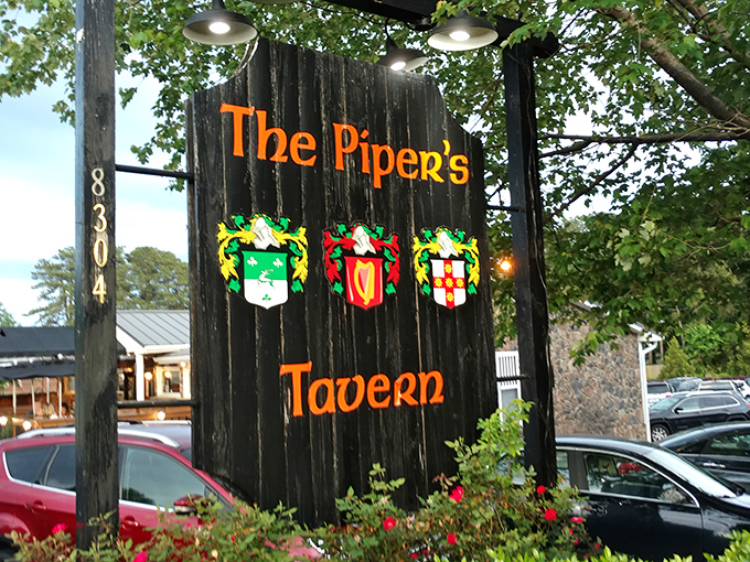 The sign stands sentinel in the parking lot, those colorful crests practically whispering, "Yes, you've finally found us. Come on in."