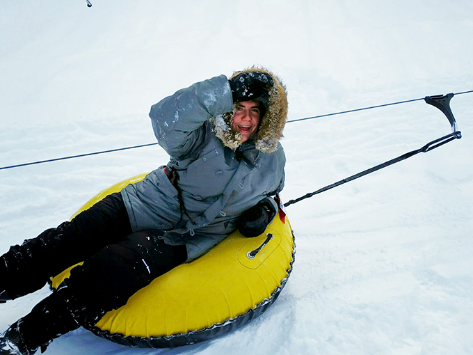 Winter thrills require minimal skills! Snow tubing combines childhood joy with adult-approved excitement on Blue Knob's snowy slopes.