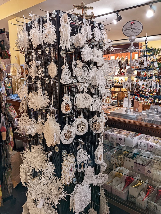 Delicate white lace ornaments hang like frozen moments of winter&mdash;snowflakes captured in thread instead of crystallized water.